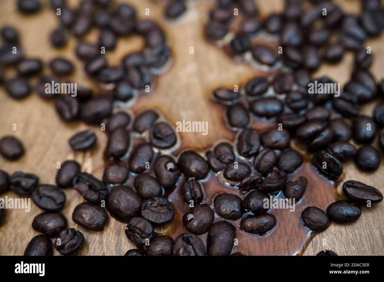Coffee beans everywhere and spilled coffee Stock Photo - Alamy