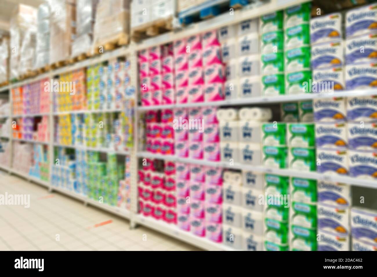 Blurred supermarket background. Selling household goods in a ...