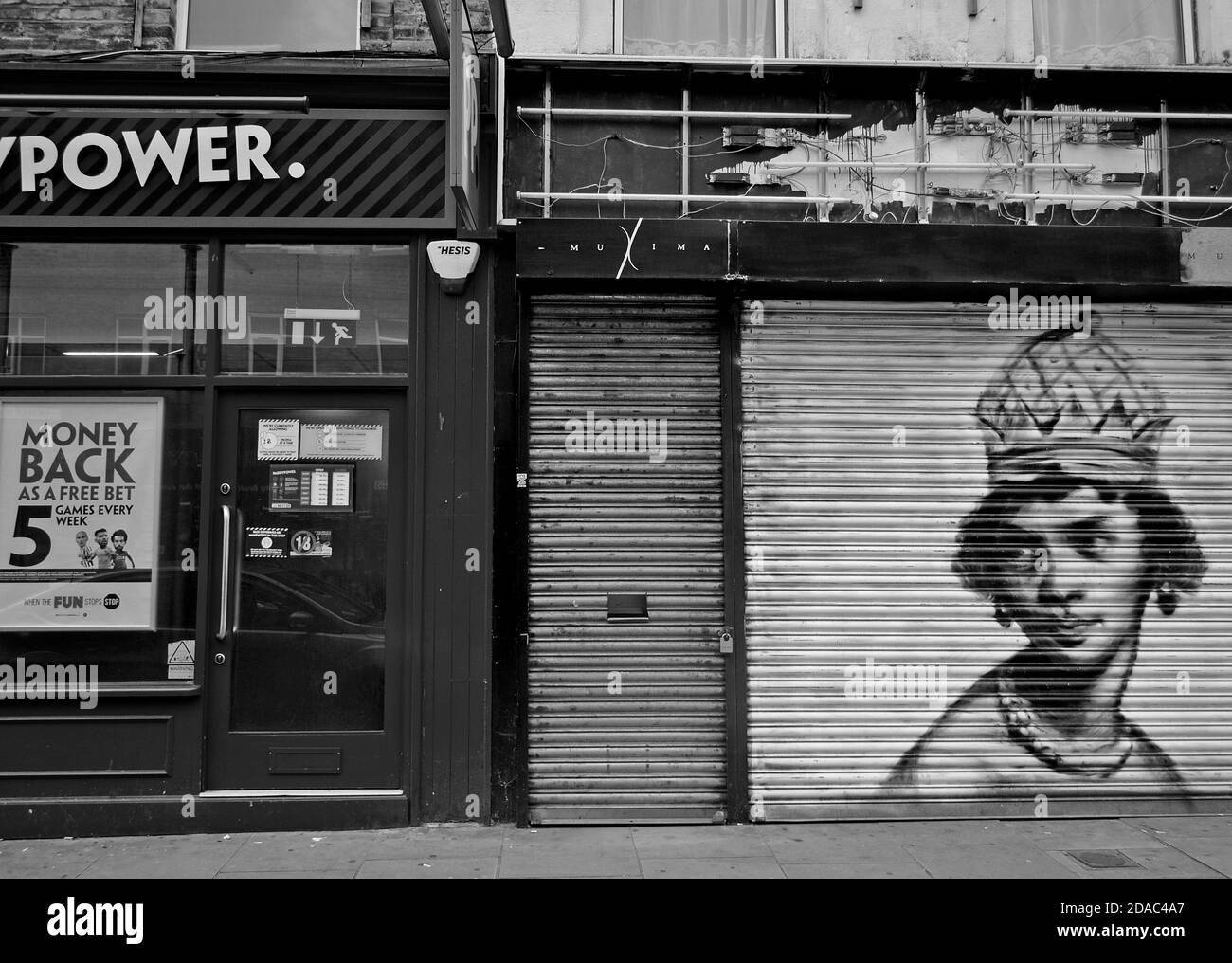 Shutter art on a closed cafe on Roman Road, is of Queen Anna Nzinga, a ...
