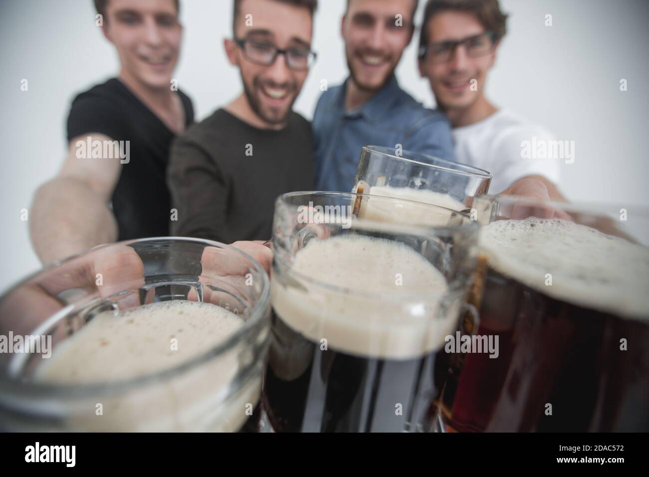 stylized photo .group of friends with beer mugs Stock Photo - Alamy
