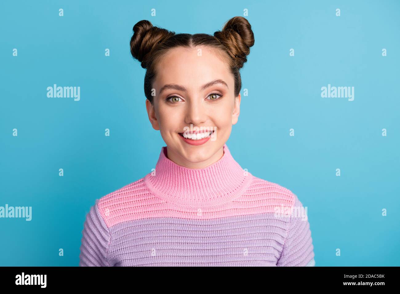 Closeup photo of attractive teen lady two funny buns good mood toothy ...