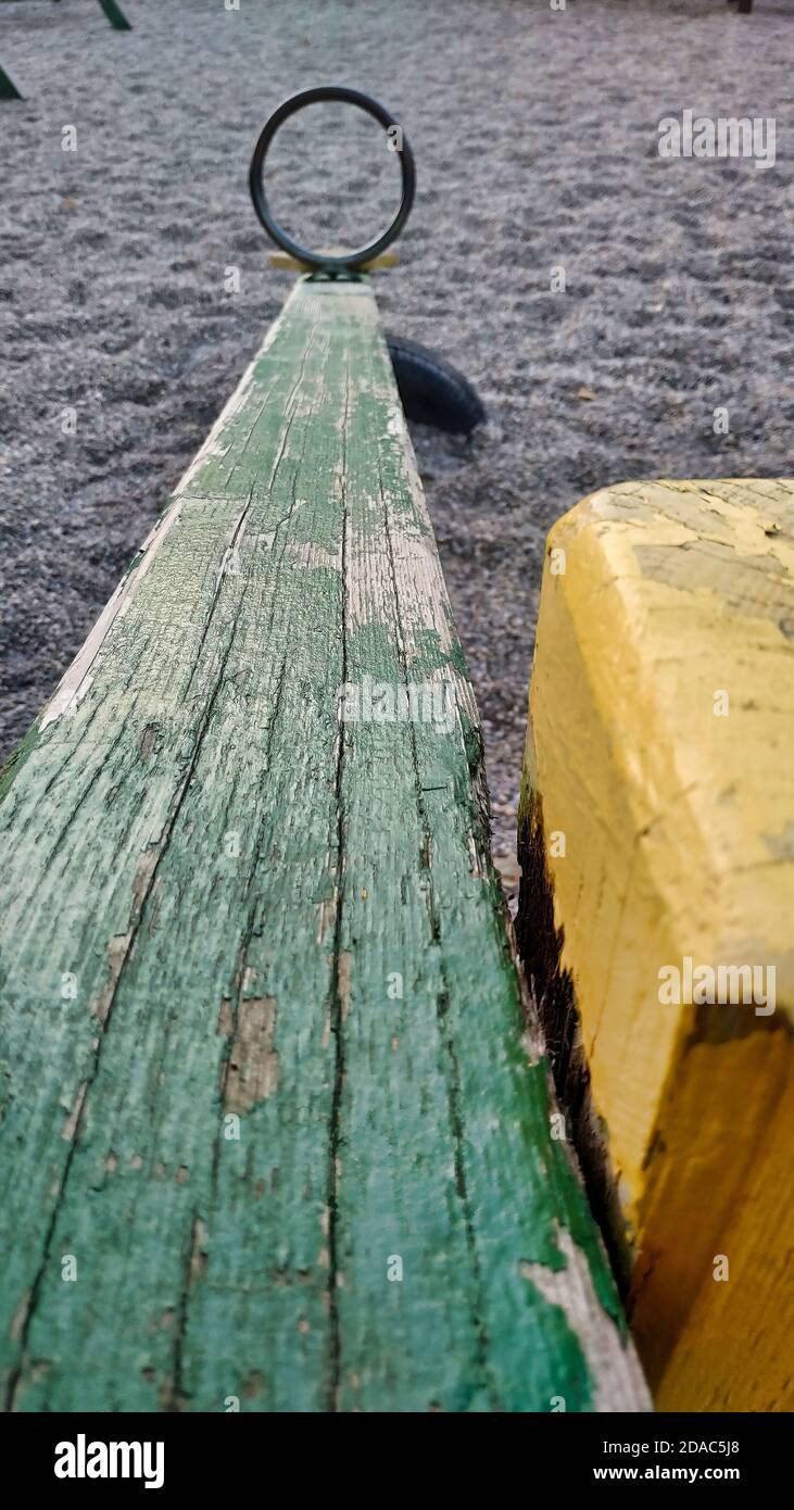 Old wooden seesaw in a playground Stock Photo - Alamy