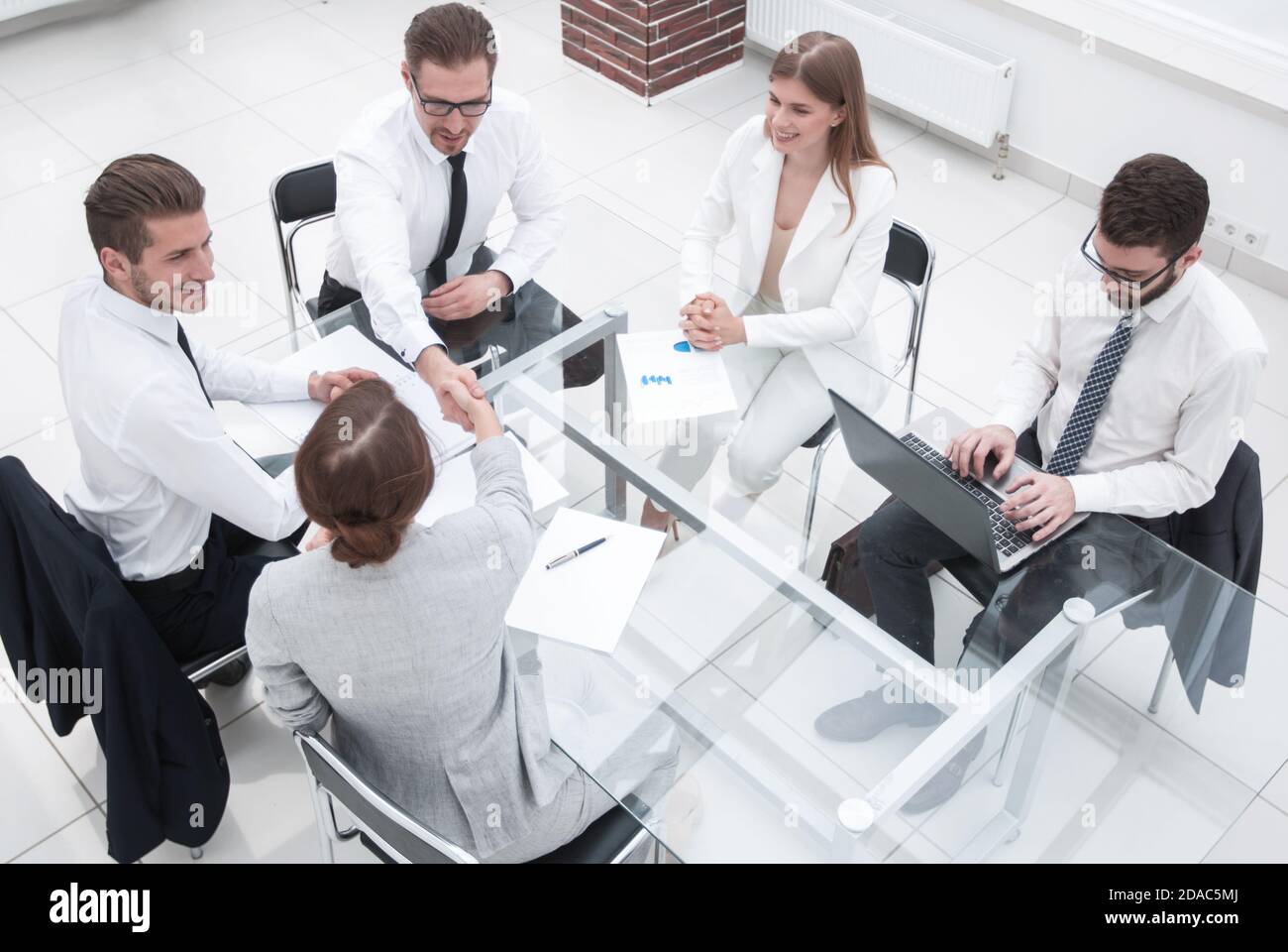 top view.handshake business partners at the negotiating table Stock ...