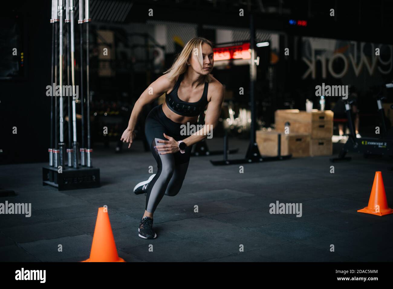 Middle shot portrait of young woman runner with athletic body wearing ...