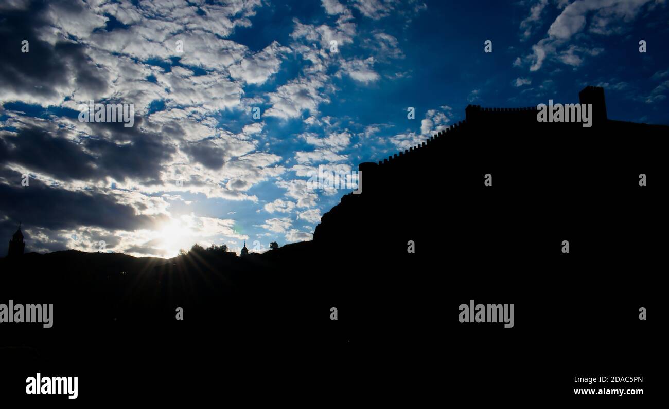Backlit outline of the medieval walls of Albarracin Stock Photo - Alamy