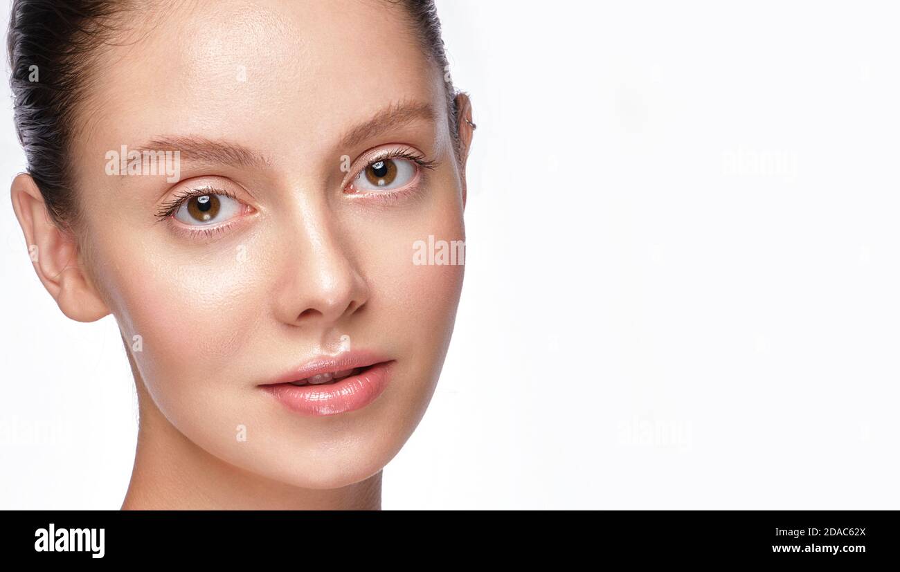Beautiful young girl with a light natural make-up and perfect skin ...