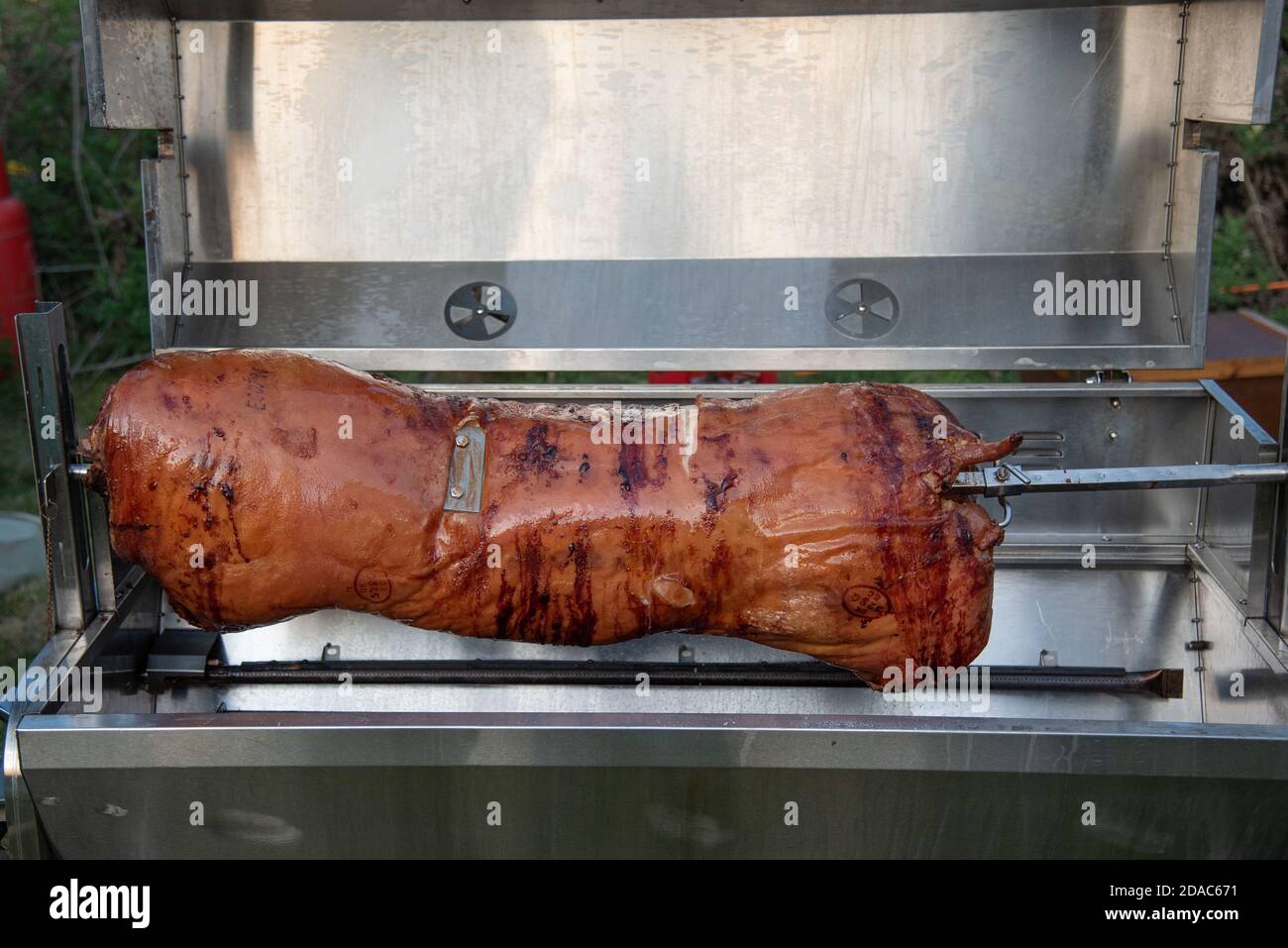 Pork being cooked on a barbecue Stock Photo - Alamy