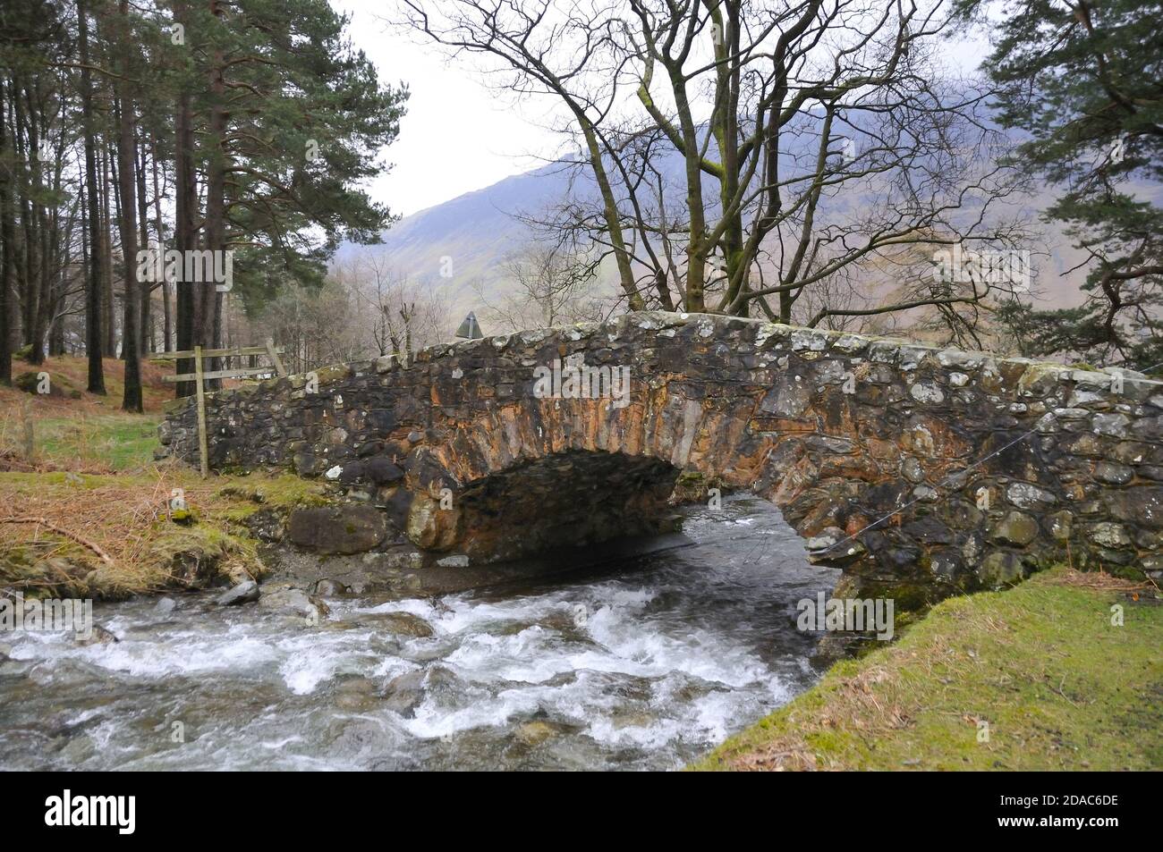Traditional stone bridge on the road to Wasdale Head alongside Wast ...