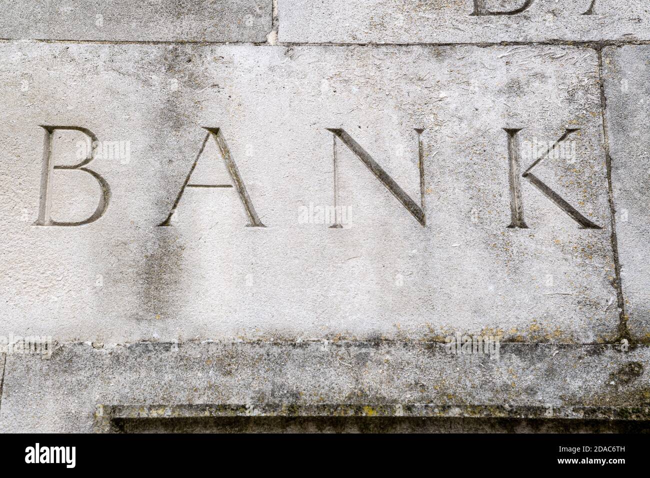 Elegant bank sign carved in to stone wall Stock Photo - Alamy