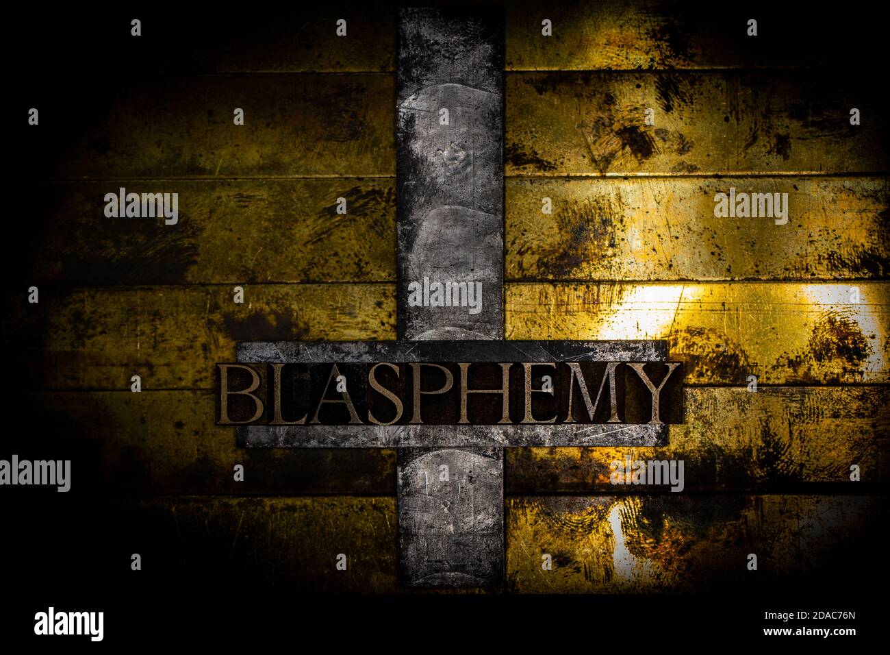 Blasphemy text message on upturned lead cross with textured grunge ...