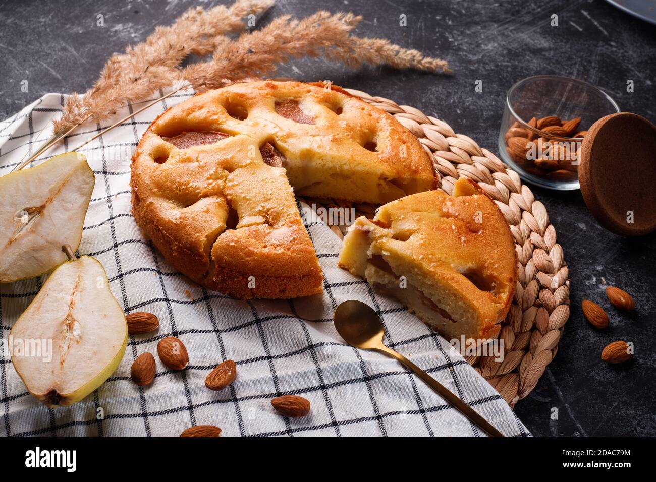 homemade crunchy pear pie on a black metal background and white ...