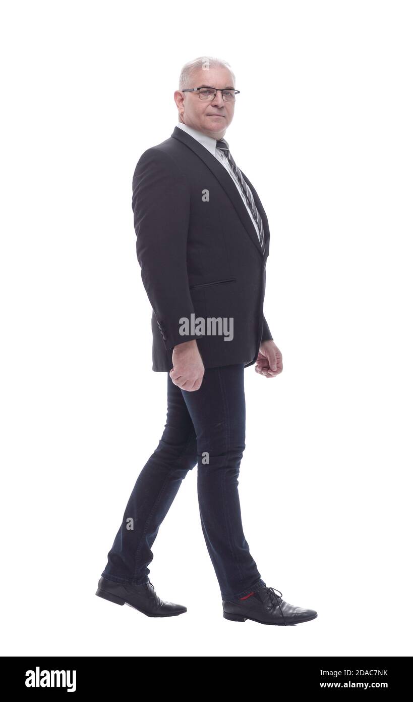 side view. confident business man striding forward Stock Photo - Alamy