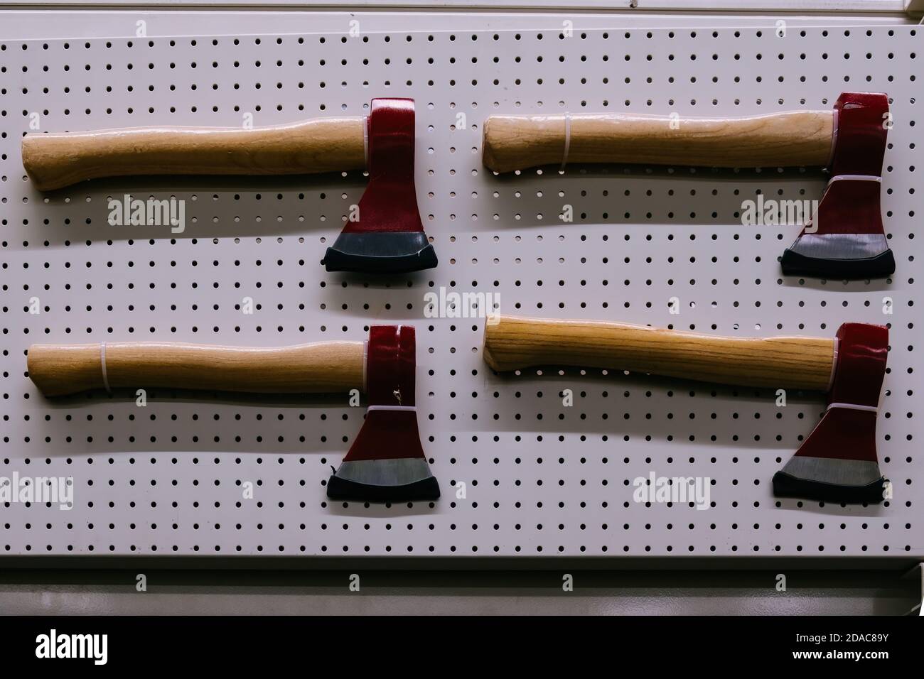 New axes for wood work in the store Stock Photo - Alamy