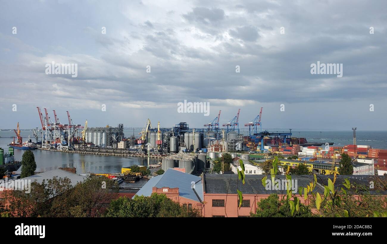 Port harbor with grain elevator terminal and container area. Industrial ...