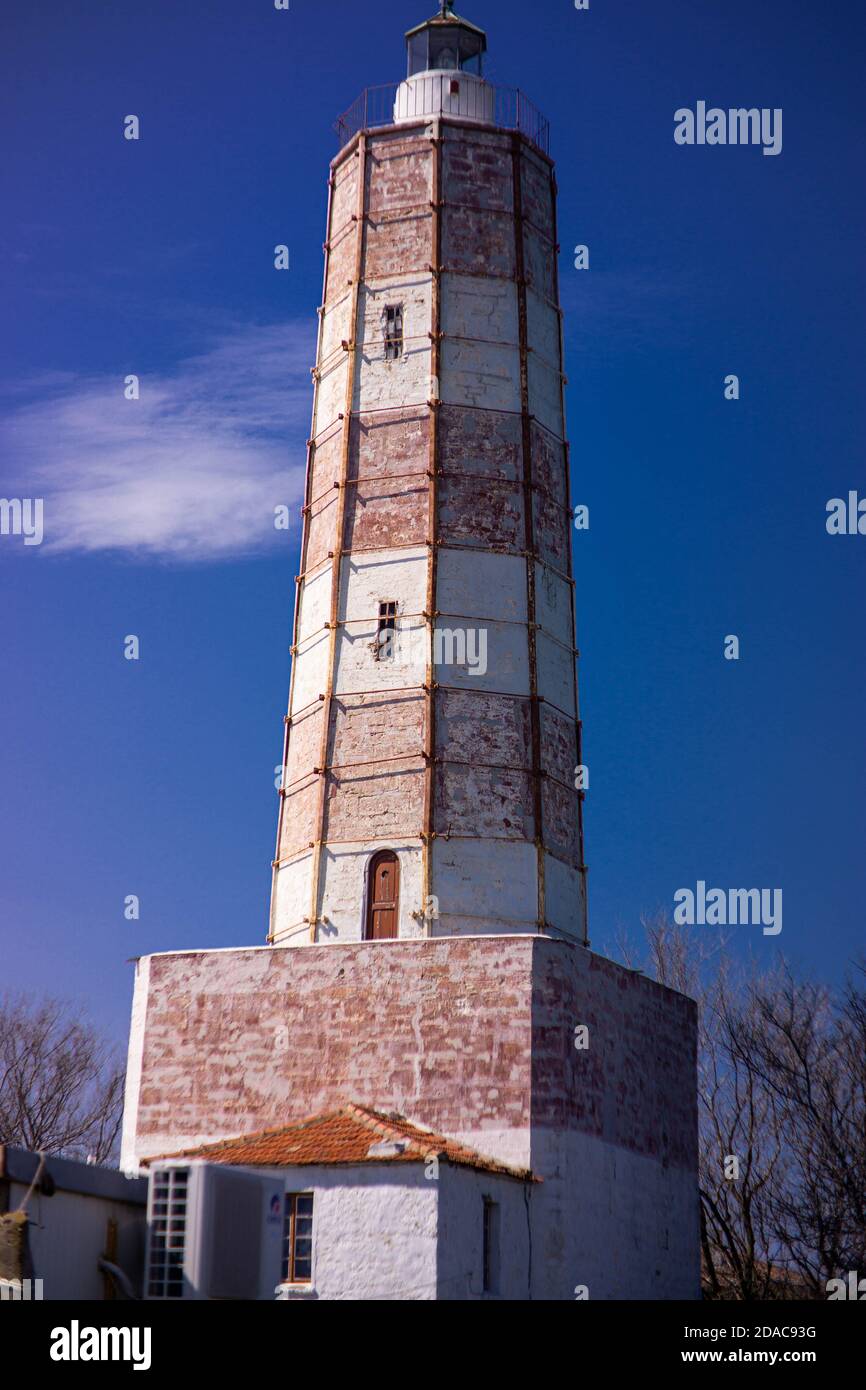 Big Lighthouse isolated on clear blue sky and one cloud Stock Photo - Alamy