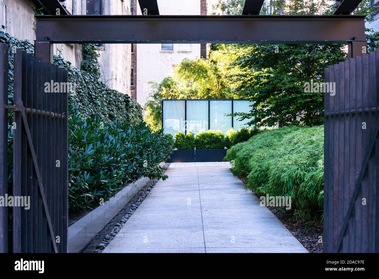 An entrance through gate into an apartment building in Manhattan, NYC ...