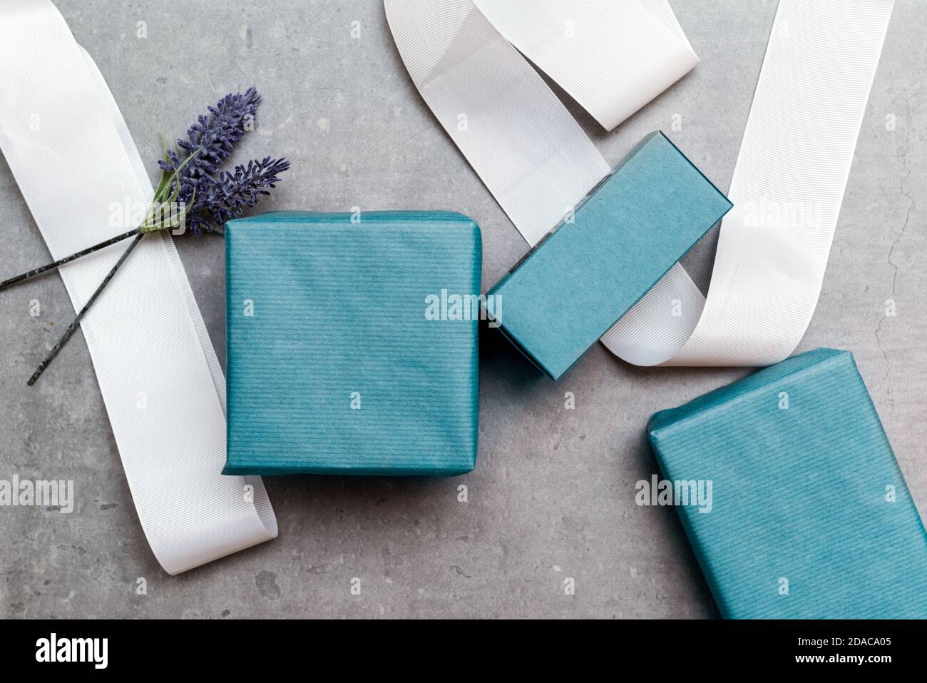 Gift wrapped boxes for christmas presents with white ribbon and ...