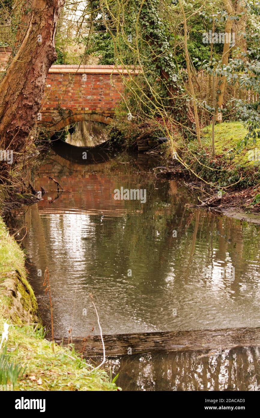 A nice little bridge going over a stream Stock Photo - Alamy