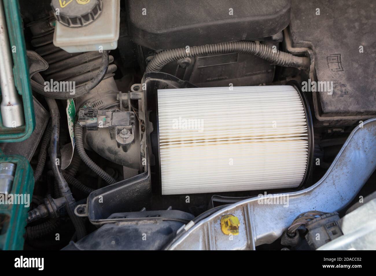 New clean air filter for vehicle engine is mounted in plastic box ...