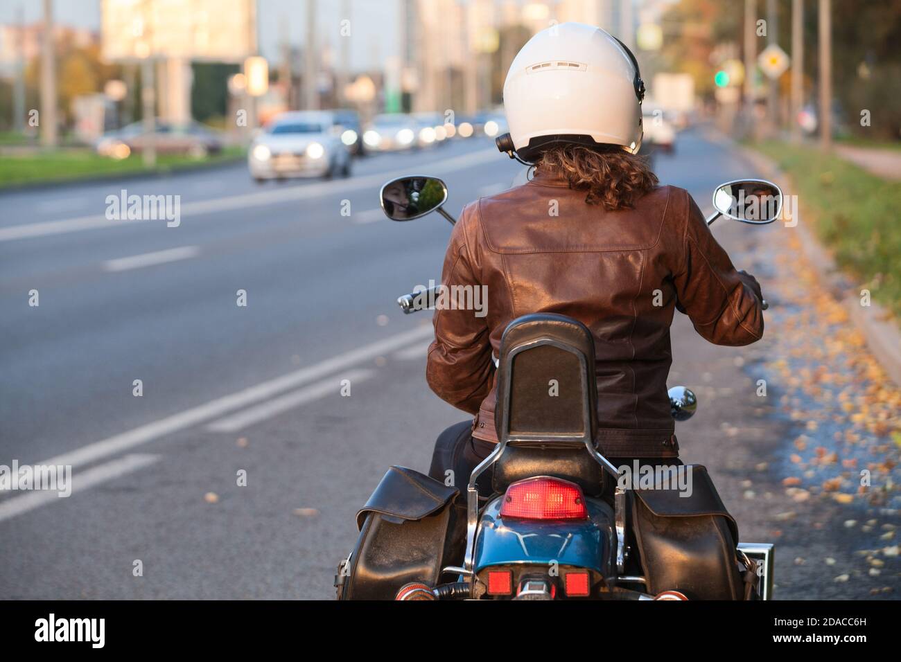 Woman sitting on back motorbike hi-res stock photography and images - Alamy
