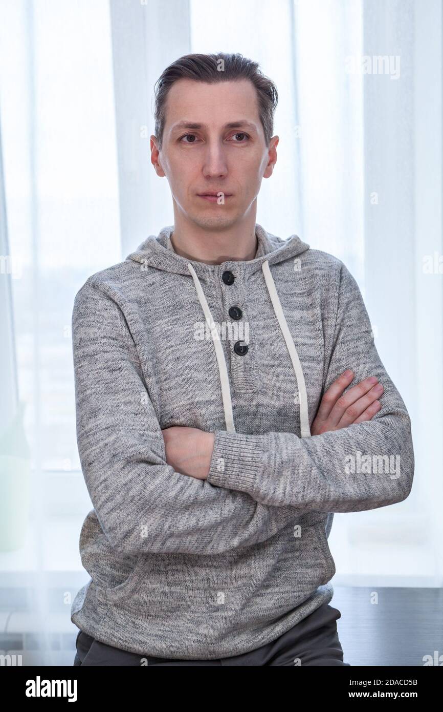 Handsome manly man arms folded hi-res stock photography and images - Alamy