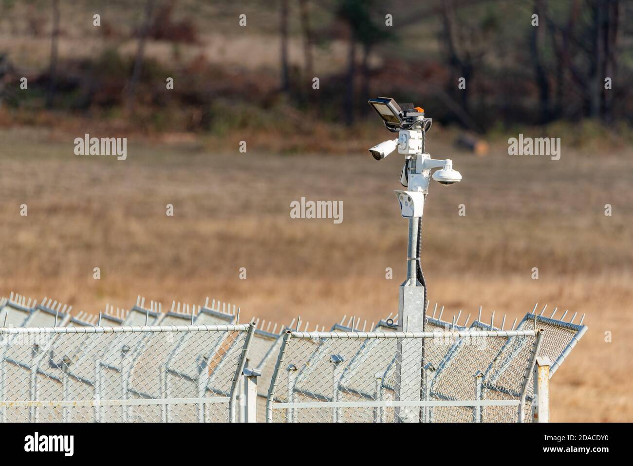 CCTV cameras mounted on pole base hidden in forest secured location ...