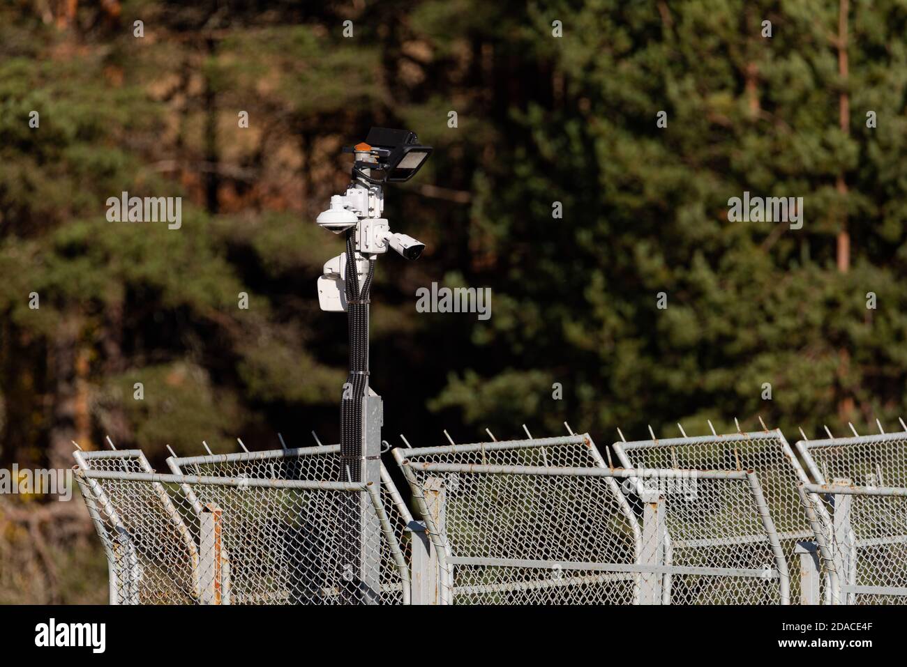 CCTV cameras mounted on pole base hidden in forest secured location ...
