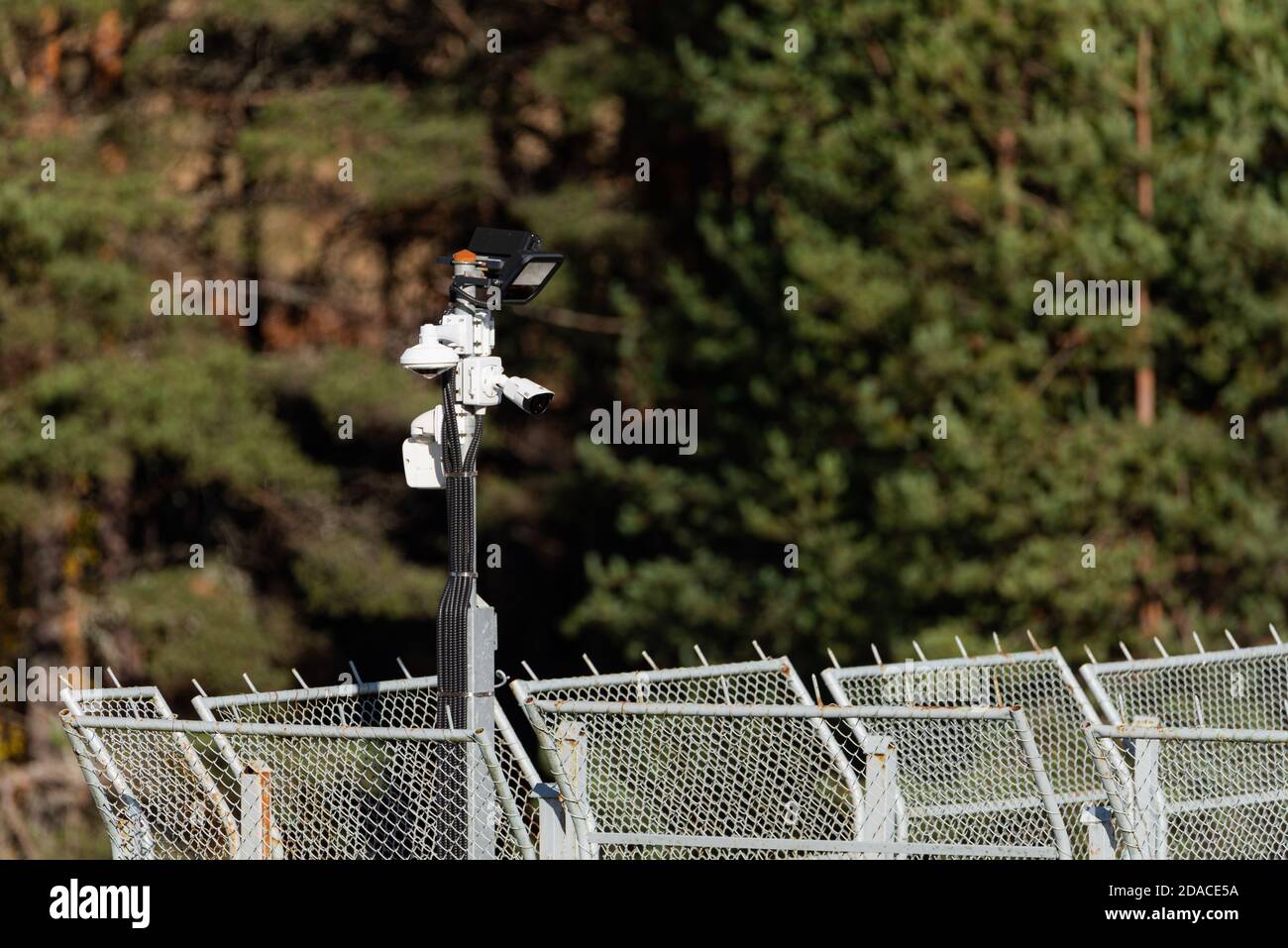 CCTV cameras mounted on pole base hidden in forest secured location ...