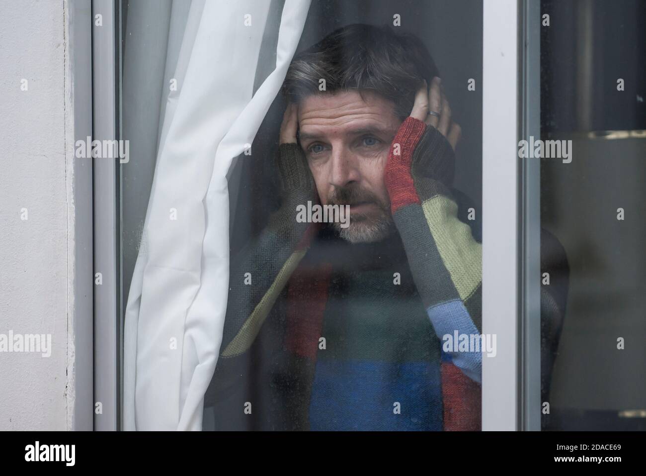 dramatic portrait of attractive sad and depressed mid adult man looking ...