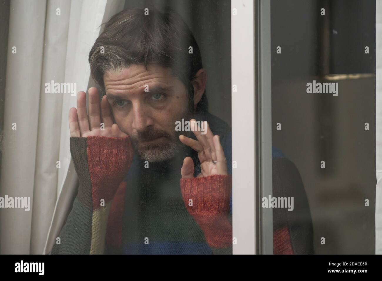 dramatic portrait of attractive sad and depressed mid adult man looking ...