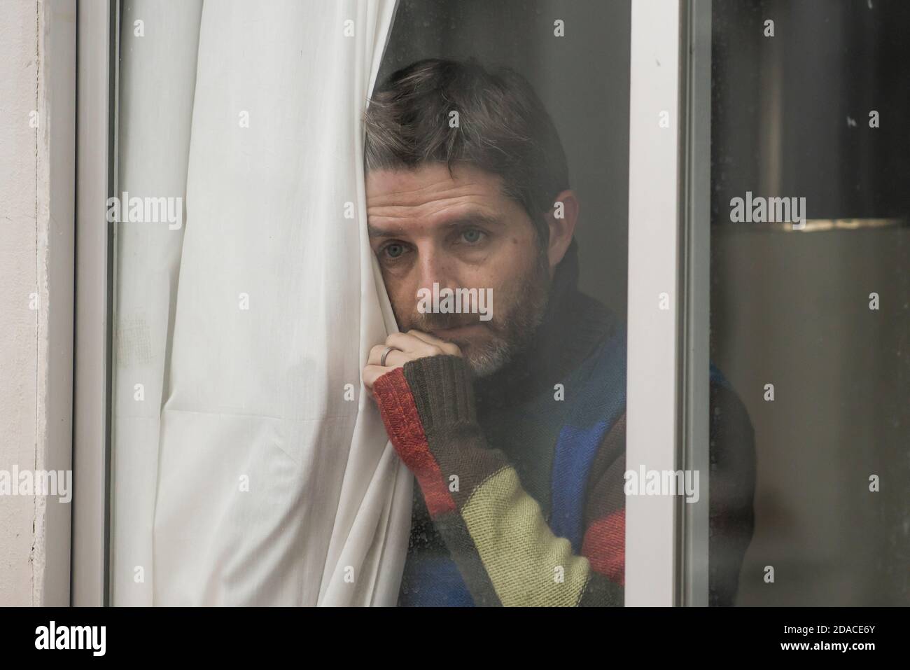 dramatic portrait of attractive sad and depressed mid adult man looking ...