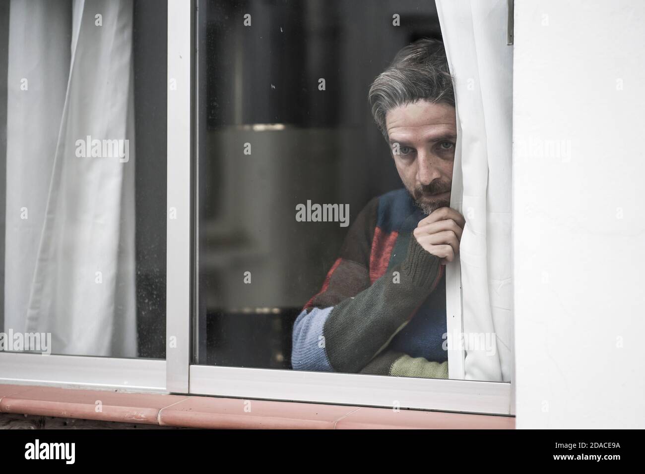 dramatic portrait of attractive sad and depressed mid adult man looking ...