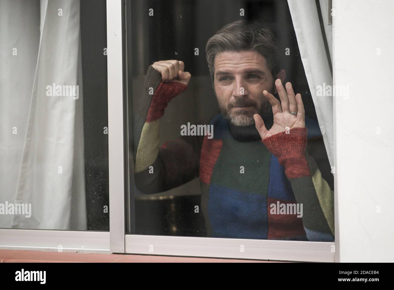 dramatic portrait of attractive sad and depressed mid adult man looking ...