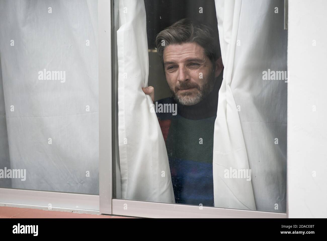 dramatic portrait of attractive sad and depressed mid adult man looking ...