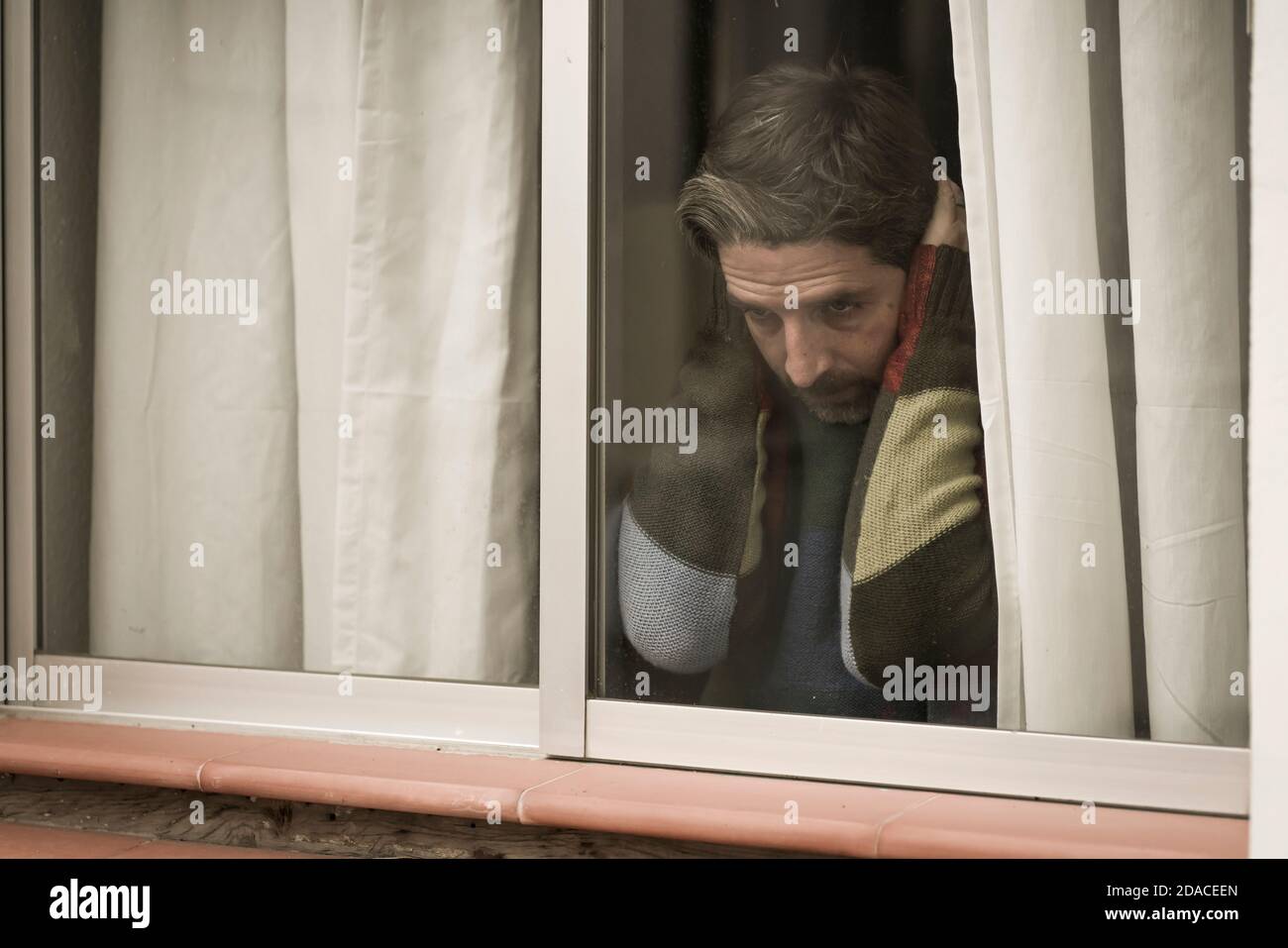 dramatic portrait of attractive sad and depressed mid adult man looking ...