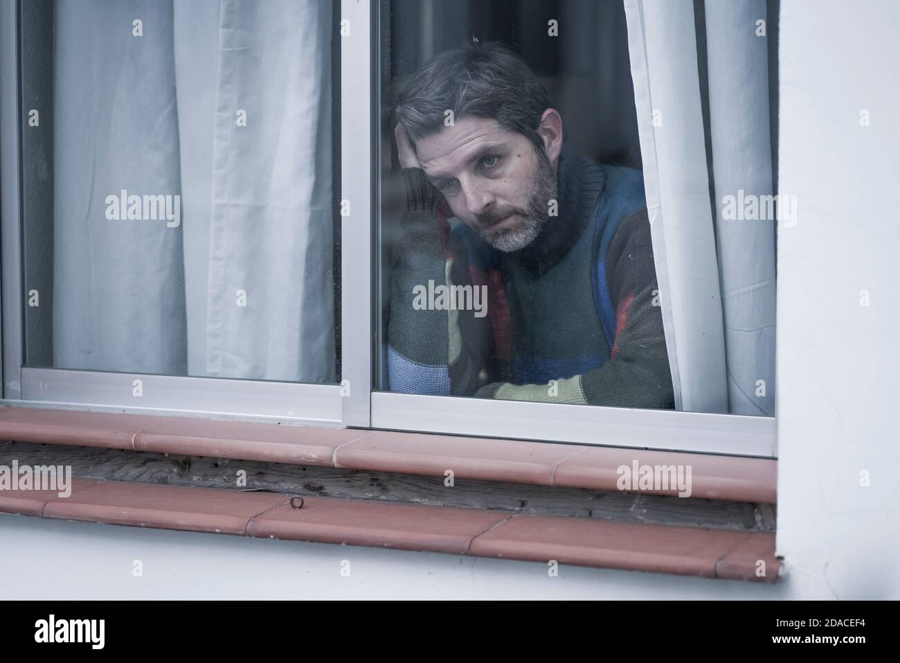 dramatic portrait of attractive sad and depressed mid adult man looking ...