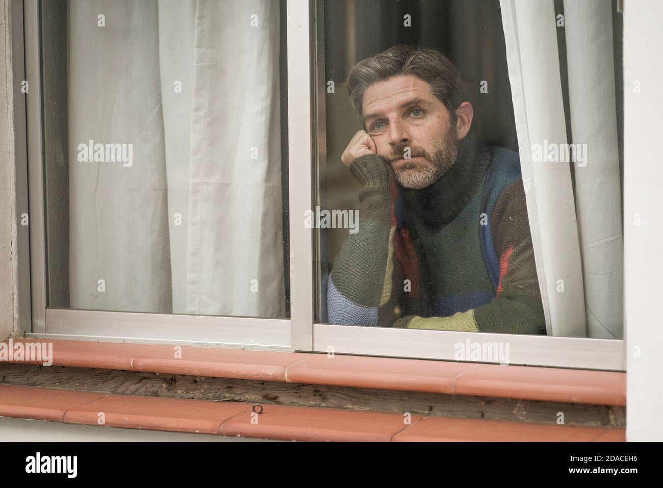 dramatic portrait of attractive sad and depressed mid adult man looking ...