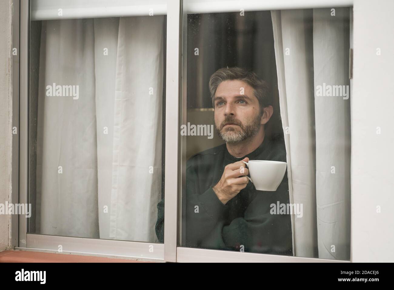 dramatic portrait of attractive sad and depressed mid adult man looking ...