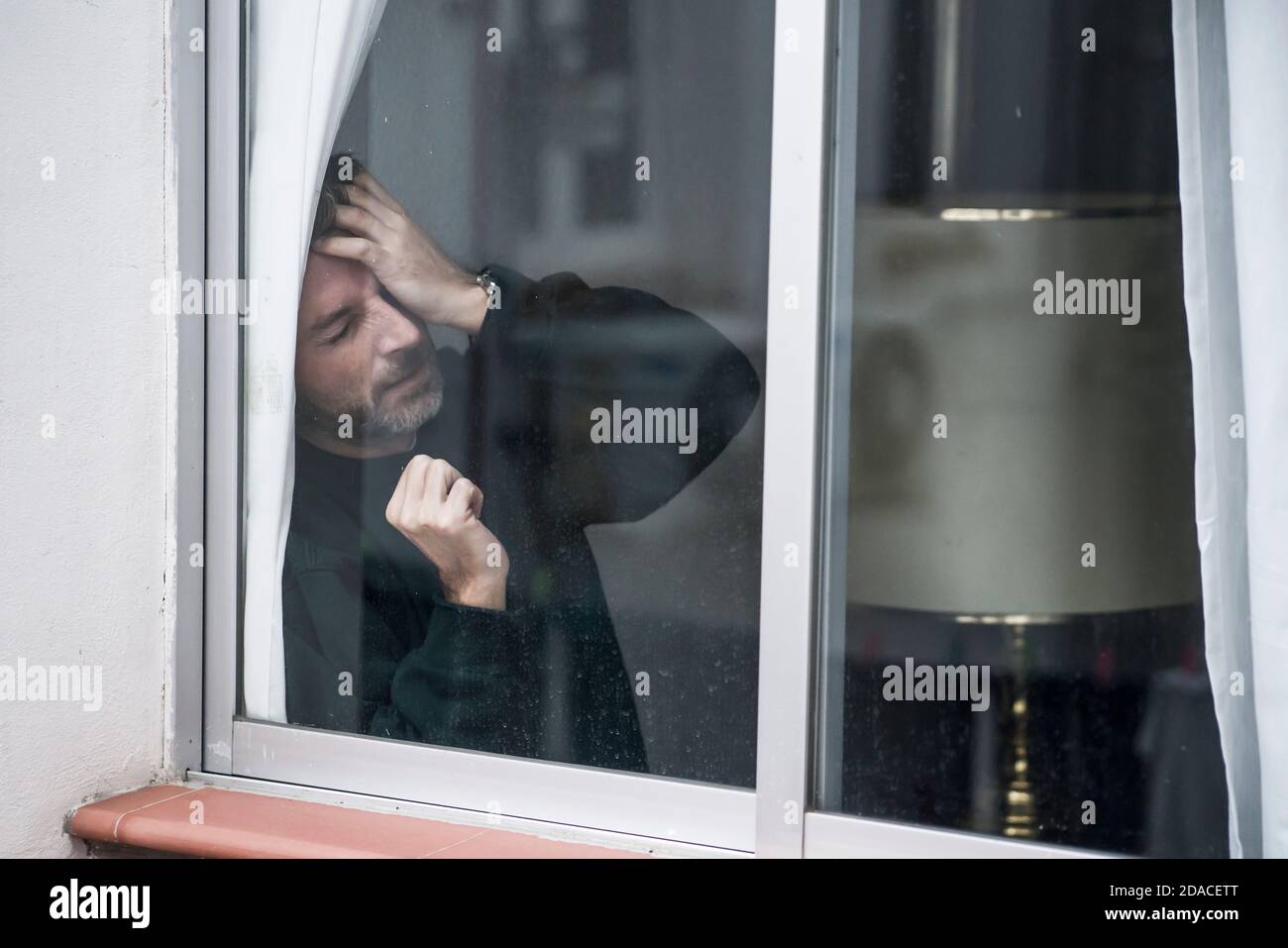 dramatic portrait of attractive sad and depressed mid adult man looking ...