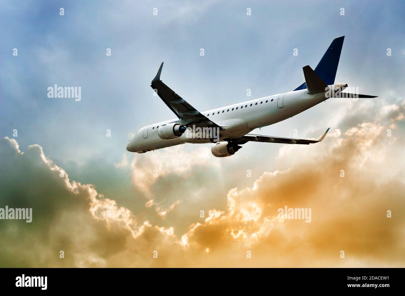 Airplane flying in the sky Stock Photo - Alamy