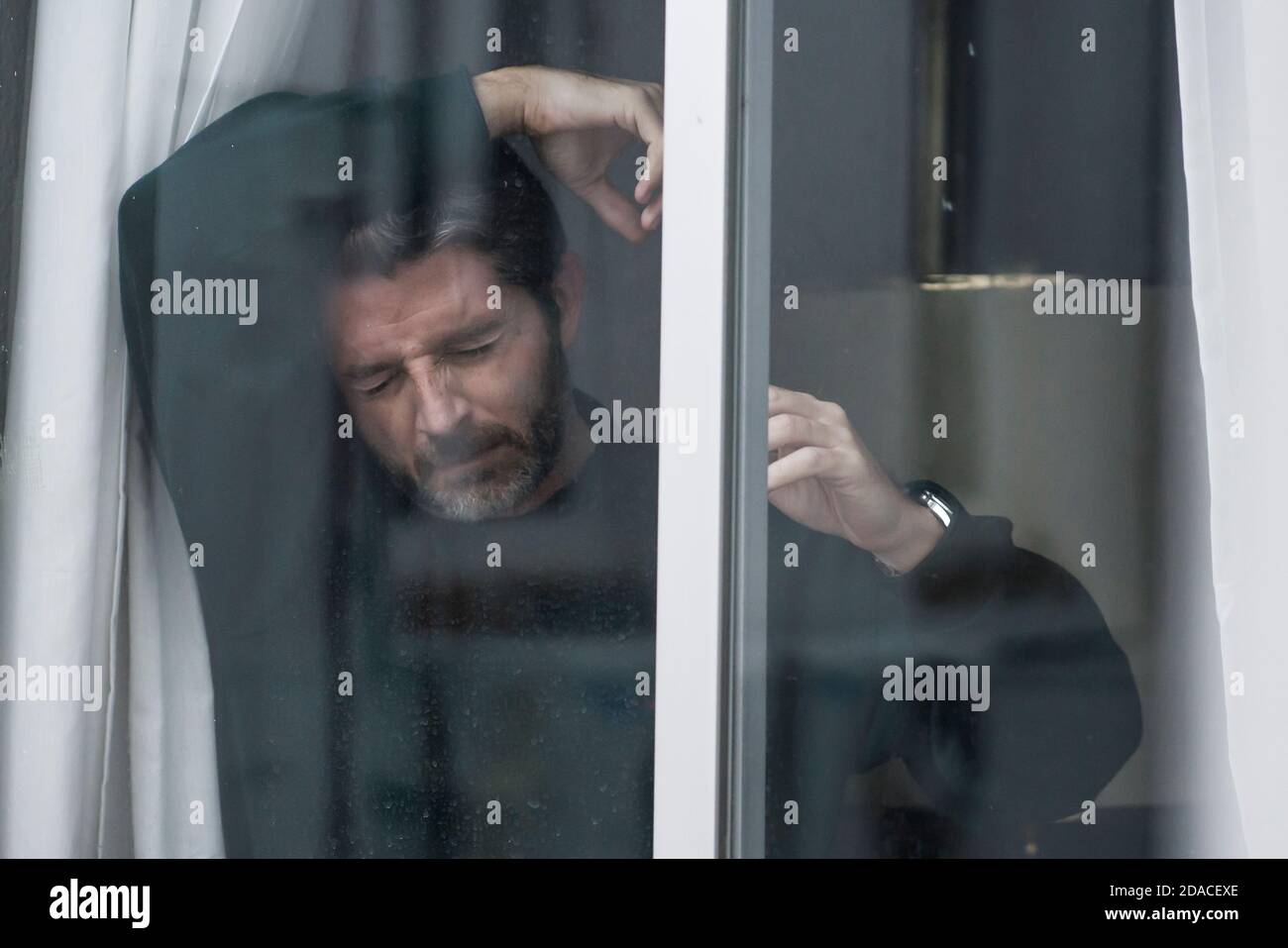 dramatic portrait of attractive sad and depressed mid adult man looking ...