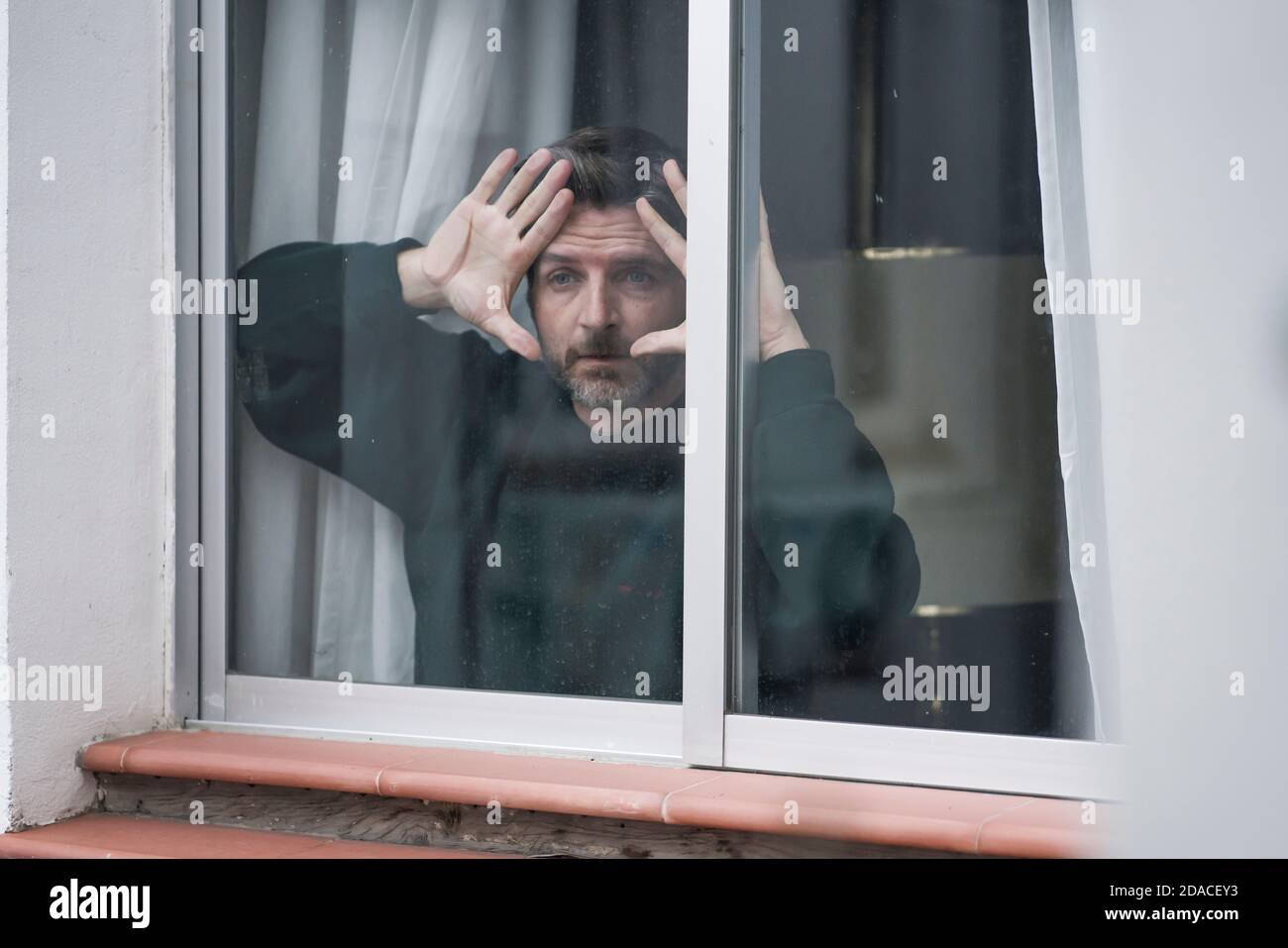 dramatic portrait of attractive sad and depressed mid adult man looking ...