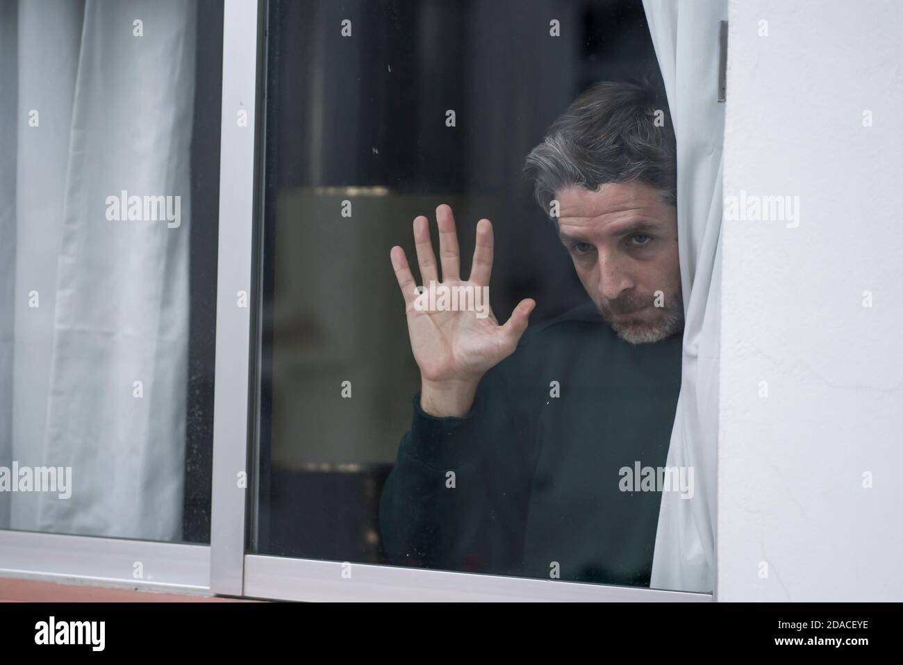 dramatic portrait of attractive sad and depressed mid adult man looking ...