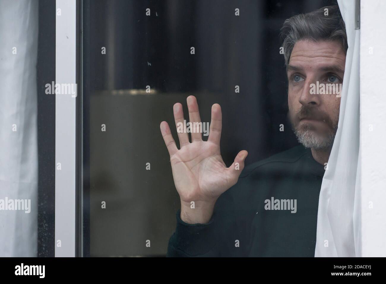 dramatic portrait of attractive sad and depressed mid adult man looking ...