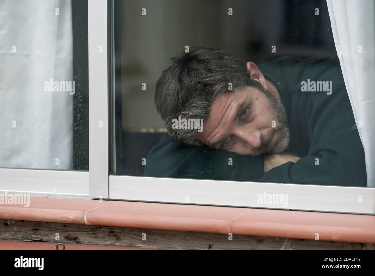 dramatic portrait of attractive sad and depressed mid adult man looking ...