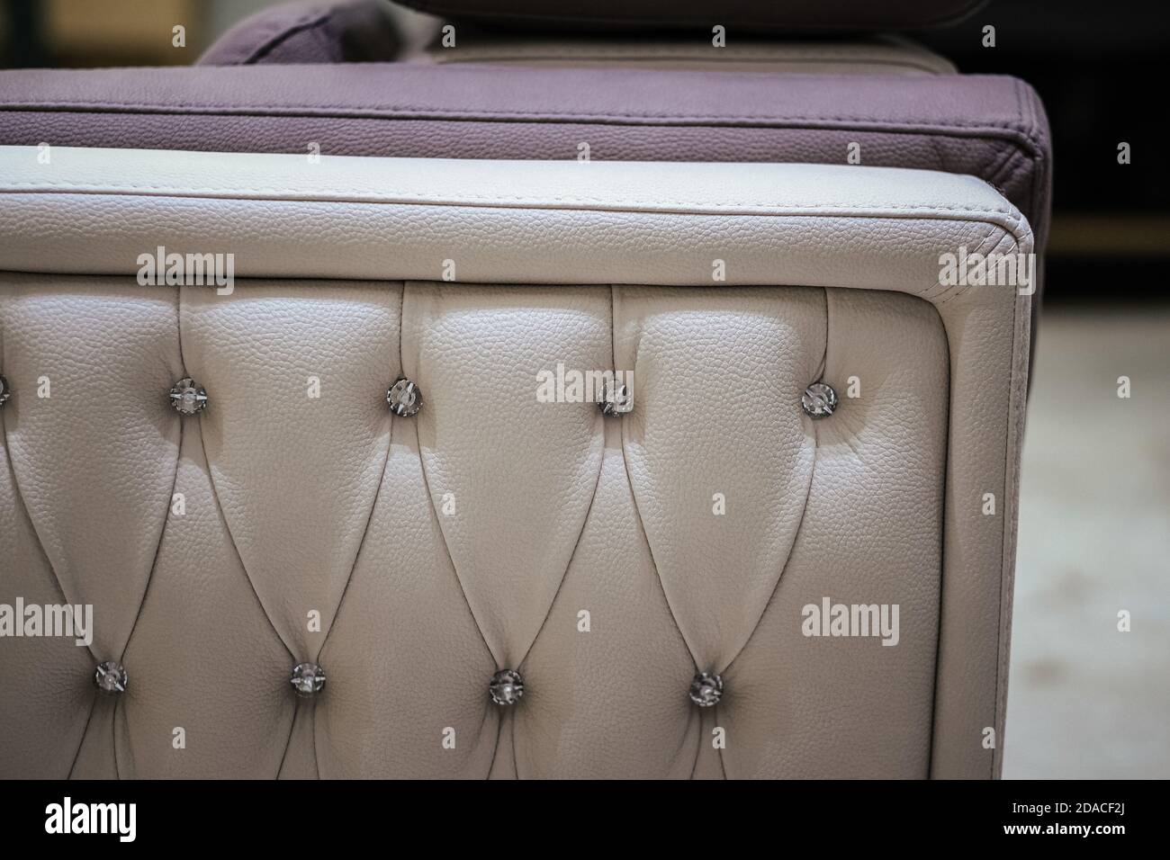 Closeup of a diamond tufting of a leather sofa Stock Photo - Alamy