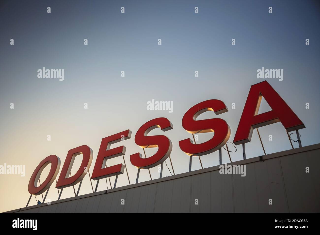 Odessa city name sign on the top of a sea port building with a blue sky ...