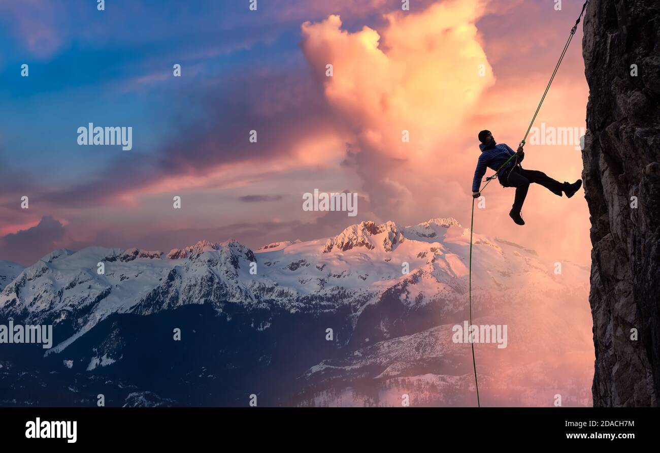 Rock Climbing Man Rappelling from a Cliff Stock Photo - Alamy