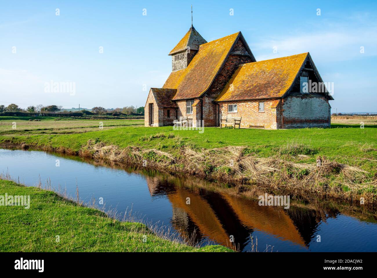St. Thomas Becket church on a bright sunny afternoon, is an English ...