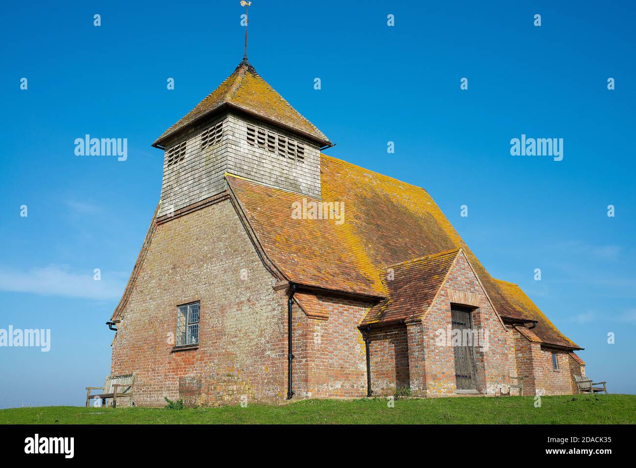 St. Thomas Becket church on a bright sunny afternoon, is an English ...